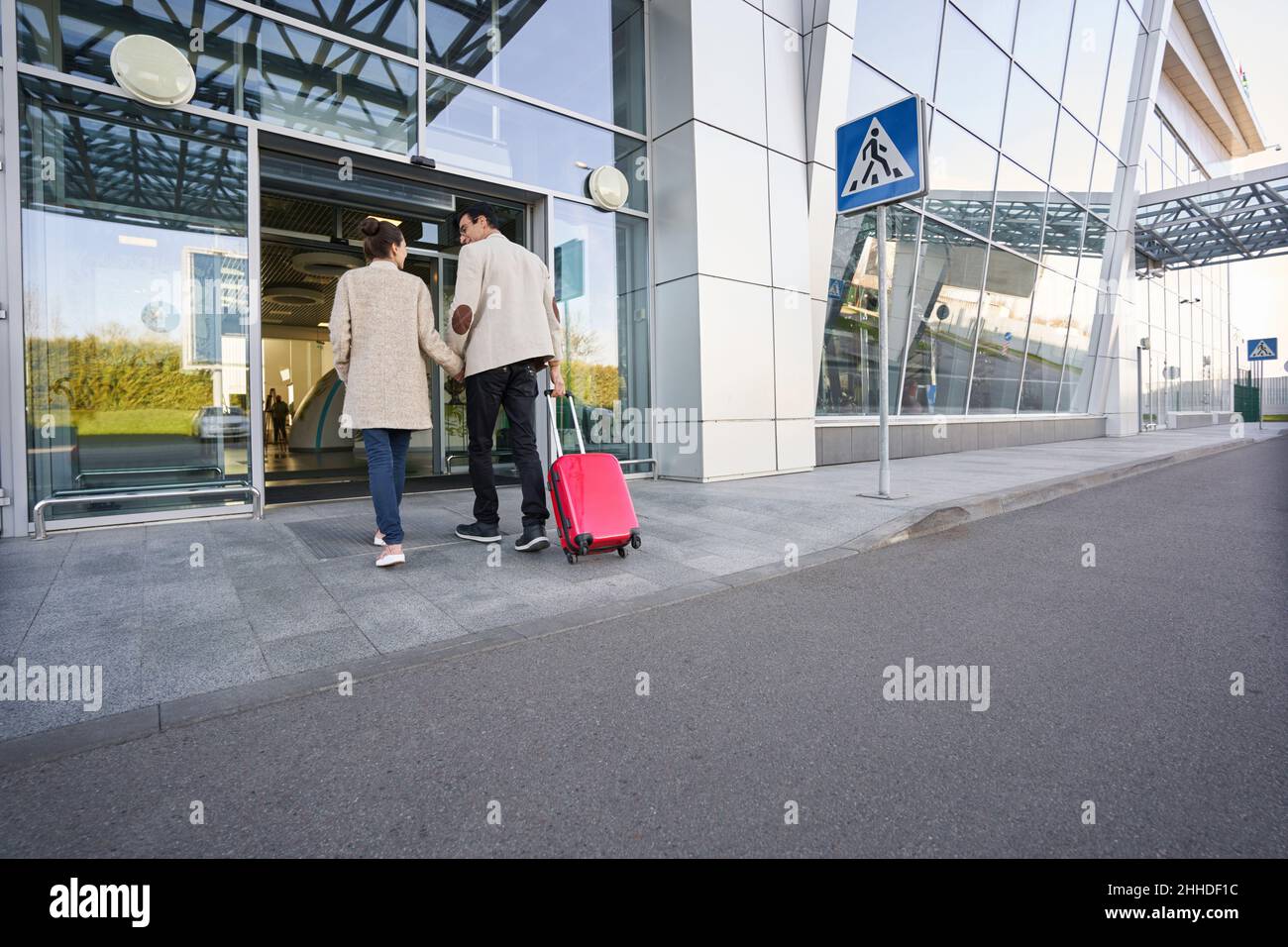 Two people entering hi-res stock photography and images - Alamy