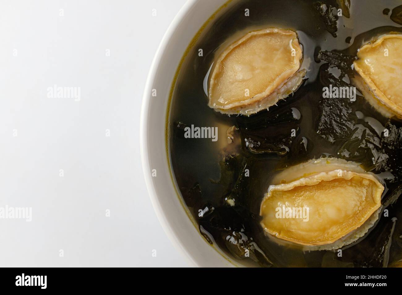 Abalone seaweed soup on a white background Stock Photo - Alamy
