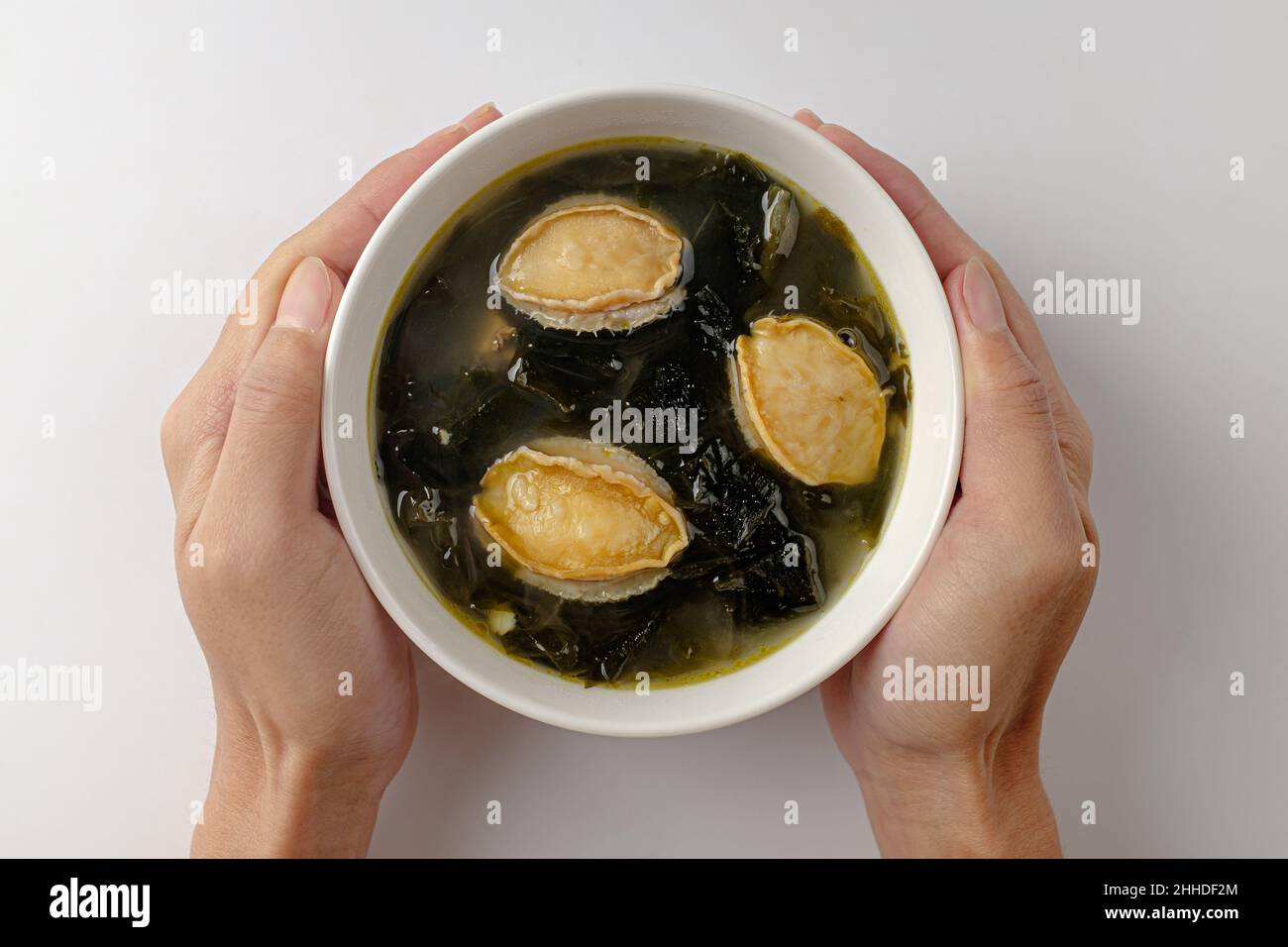 Abalone seaweed soup on a white background Stock Photo - Alamy