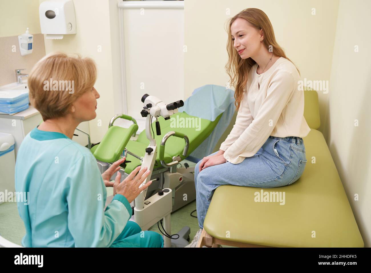 Cute patient enjoying friendly atmosphere in medical center Stock Photo ...