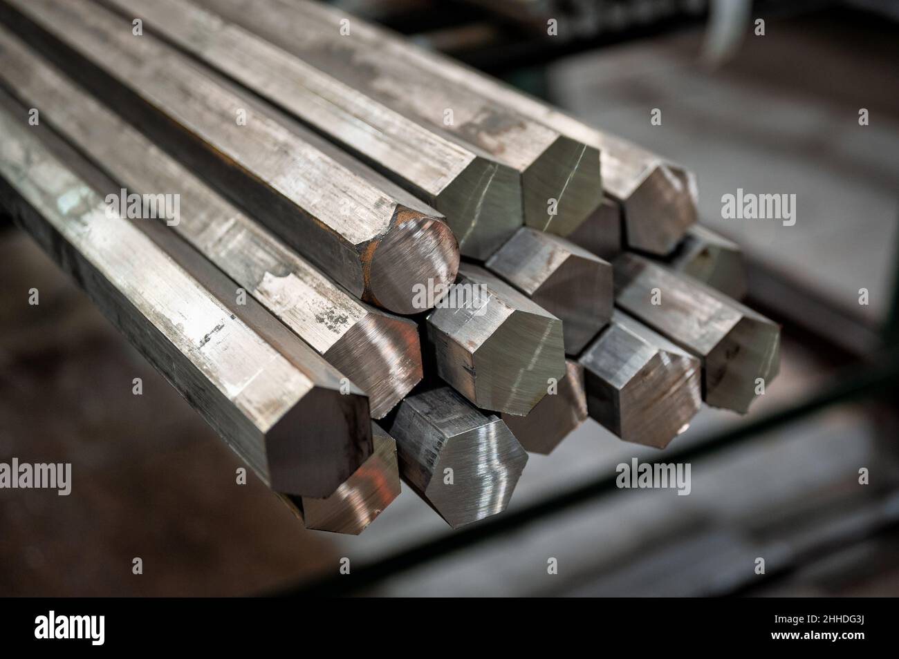 A bundle of hexagonal metal bars, steel mill products Stock Photo - Alamy