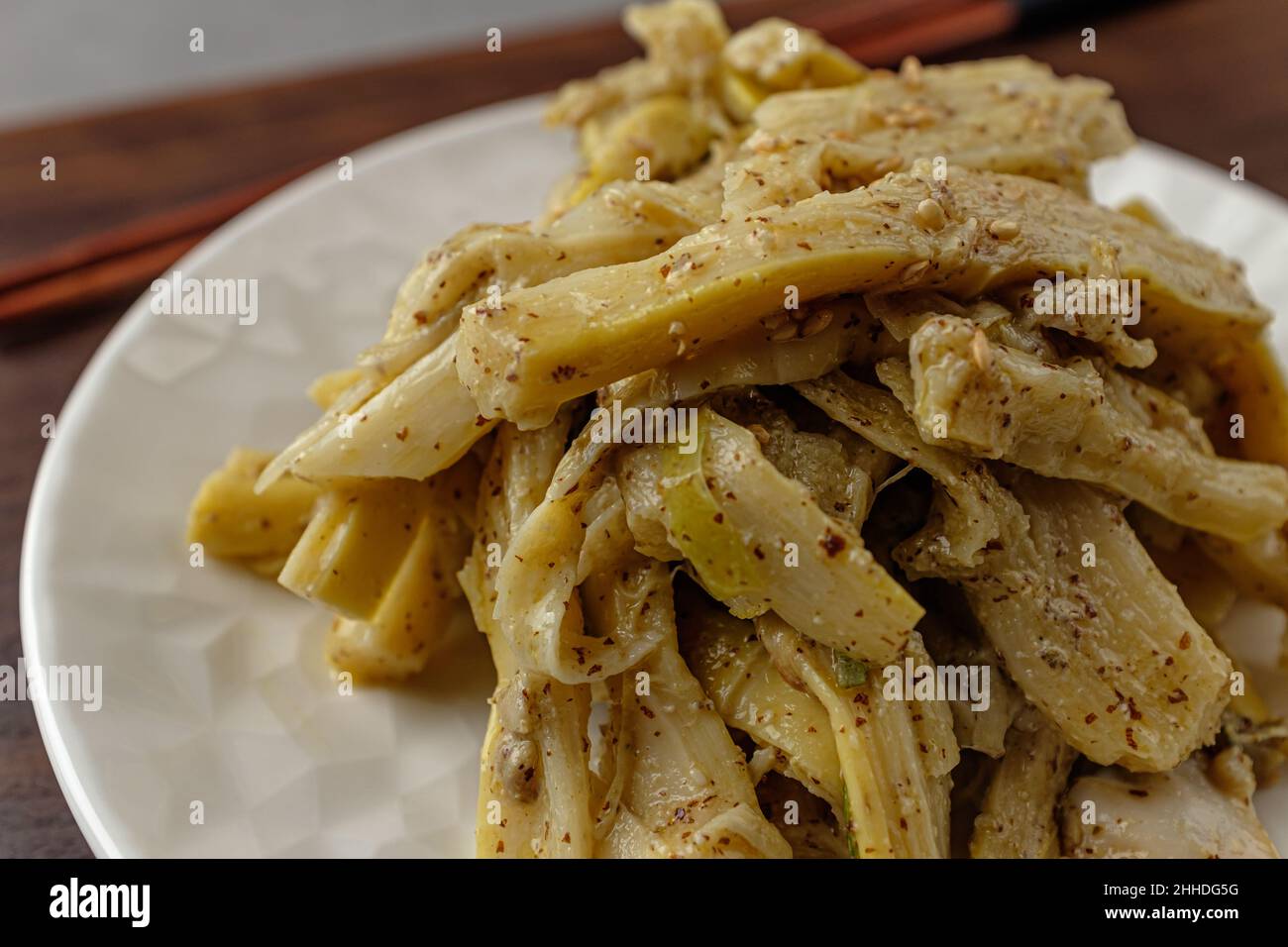 A dish of cut bamboo shoots and seasoned Stock Photo - Alamy