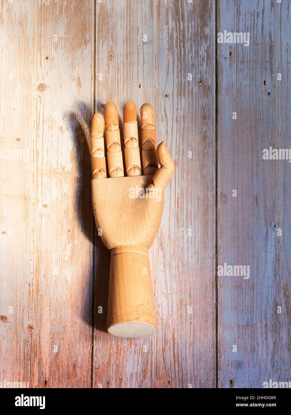 wood hand on light wood background Stock Photo - Alamy