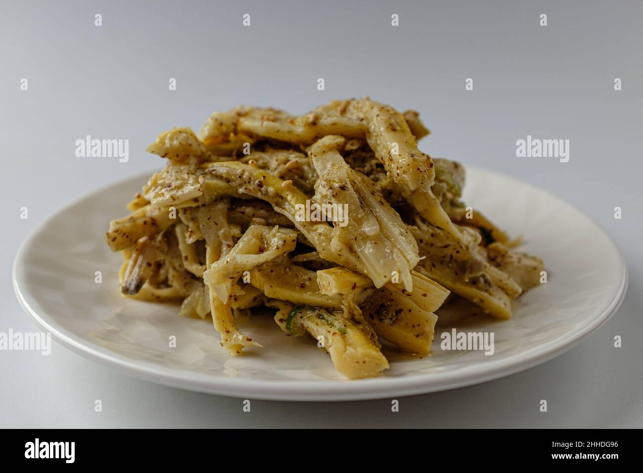 Cooking bamboo shoots on a white background Stock Photo - Alamy
