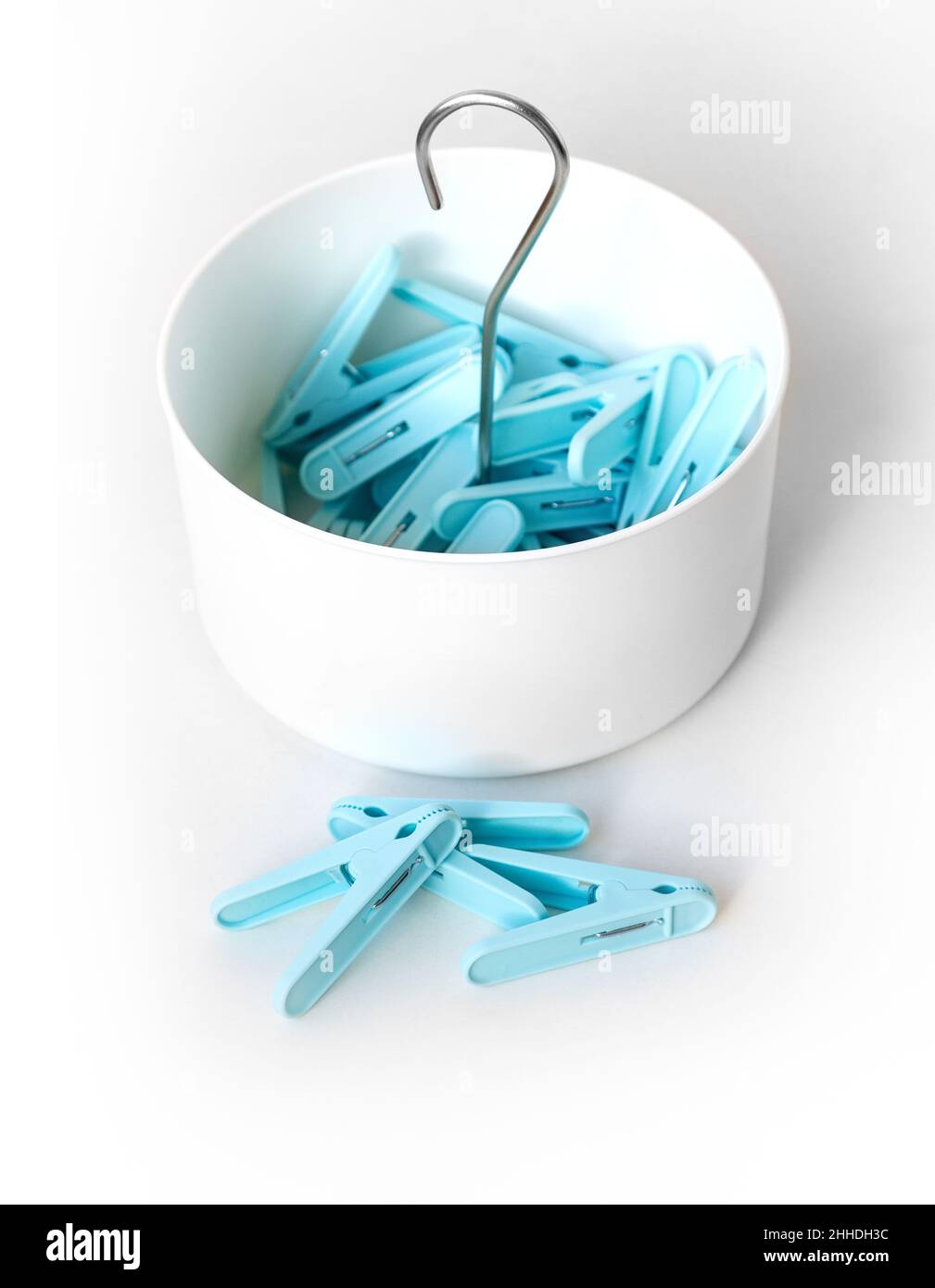 Blue clothespins isolated on white background Stock Photo - Alamy