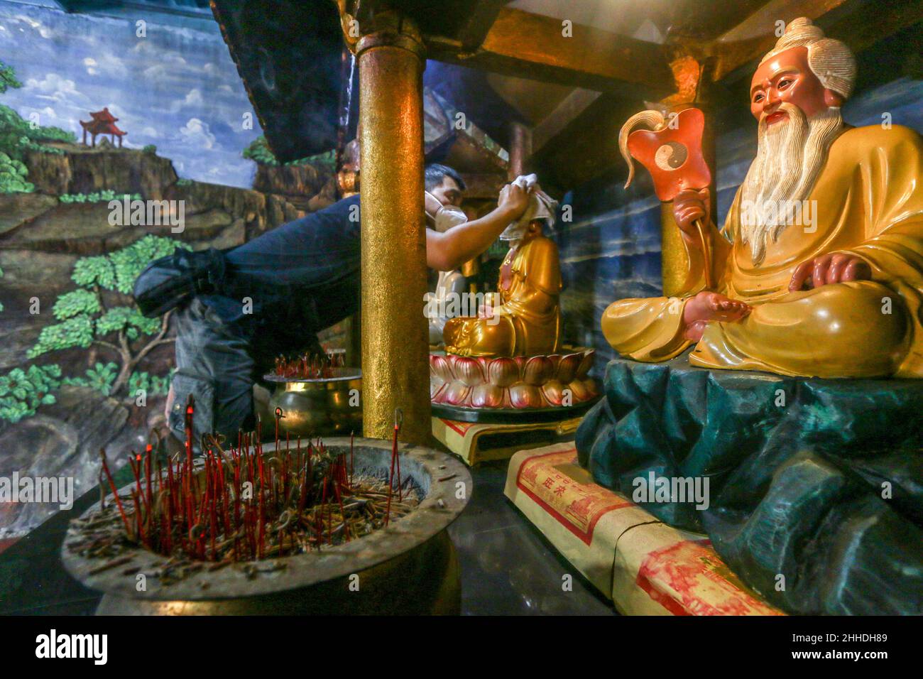 the tradition of cleaning altars and statues of gods at the Buddhist ...