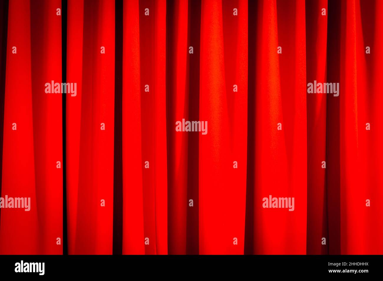 Red closed curtain with a light spot use for background Stock Photo - Alamy