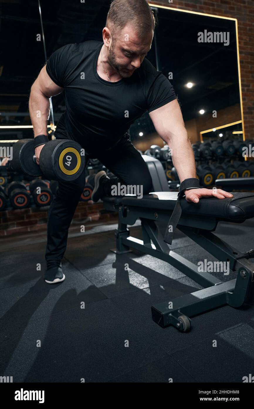 Single arm dumbbell hi-res stock photography and images - Alamy