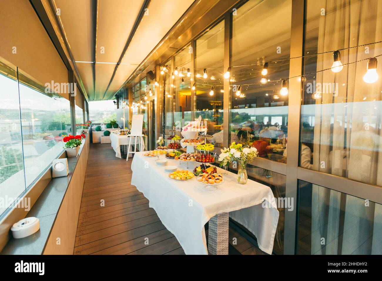 Festive buffet table with delicious desserts of different colors at the ...