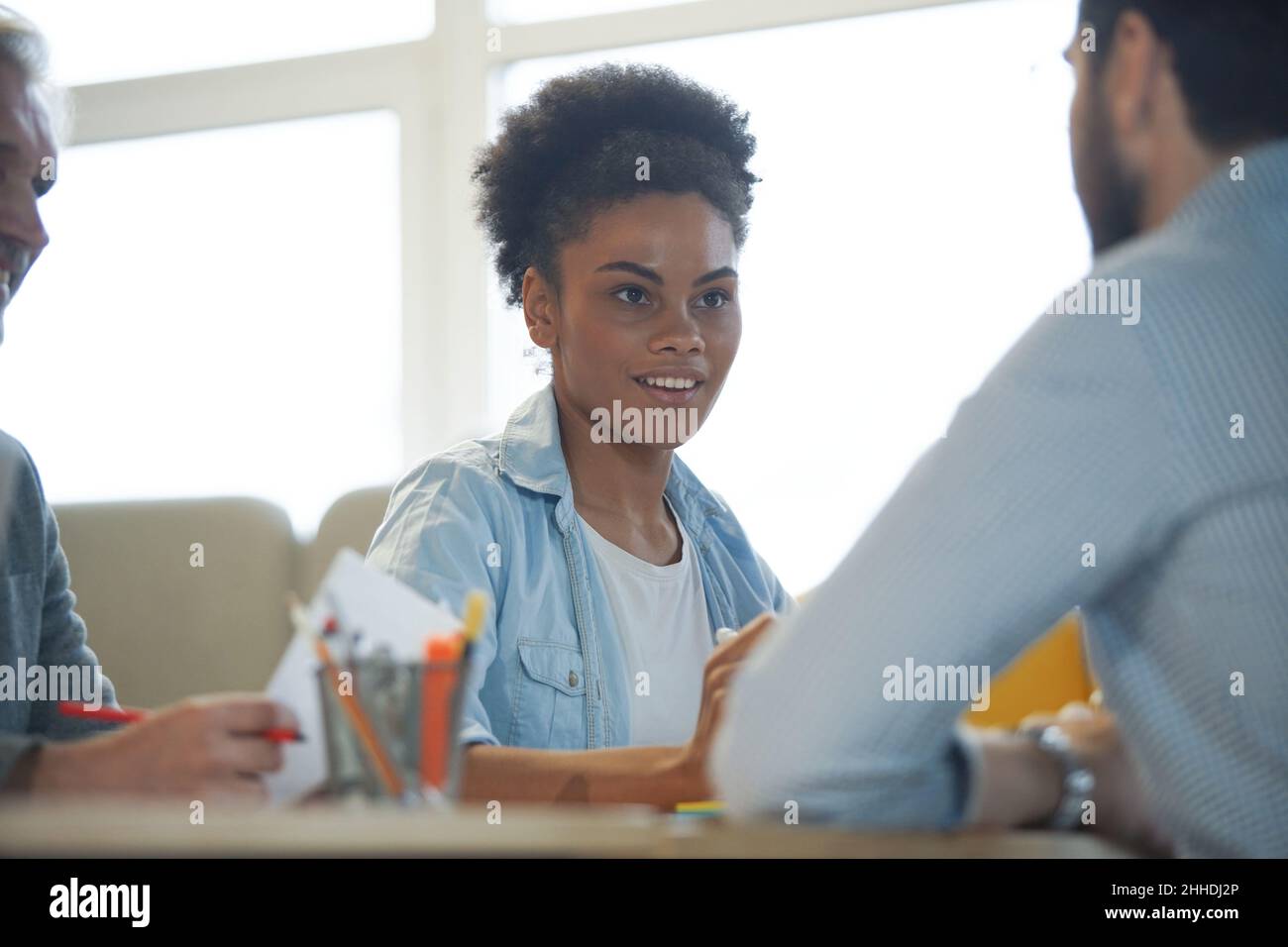 Happy young businesswoman coach mentor leader laughing at funny joke at ...