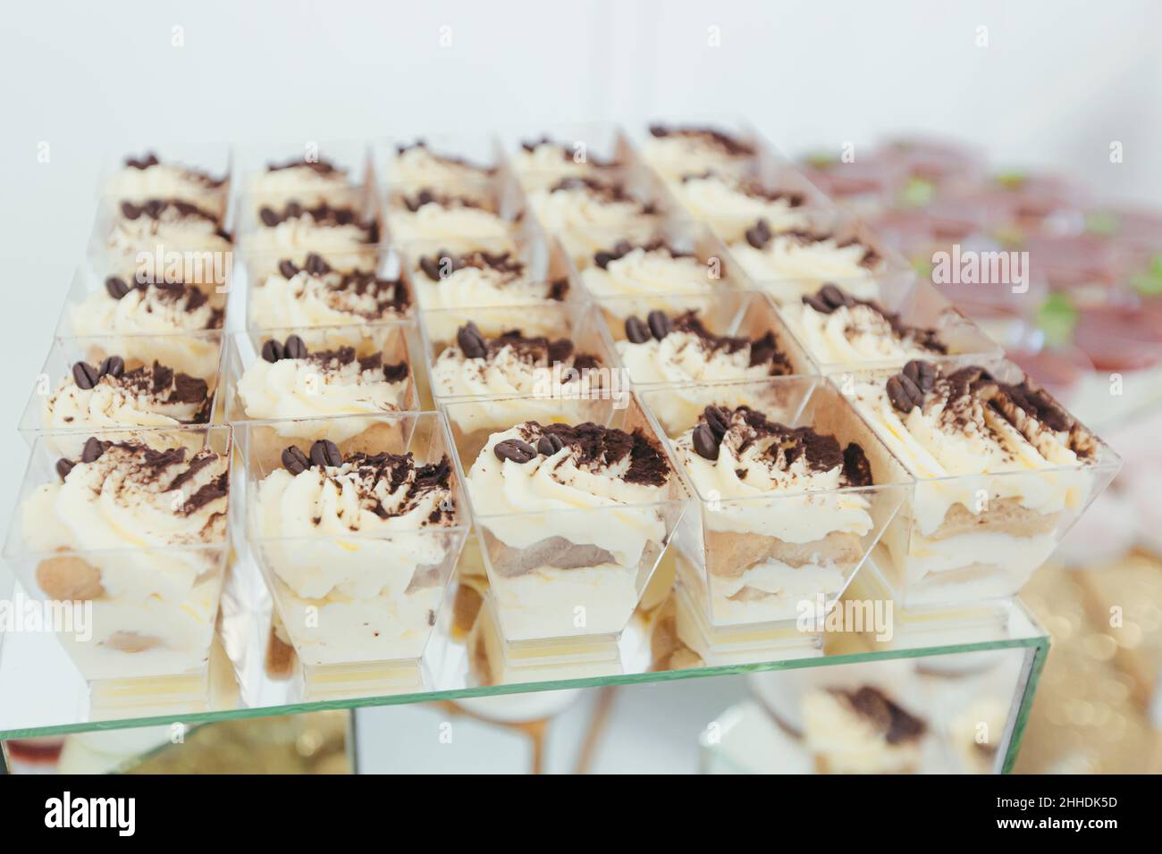 Festive buffet table with delicious desserts of different colors at the ...