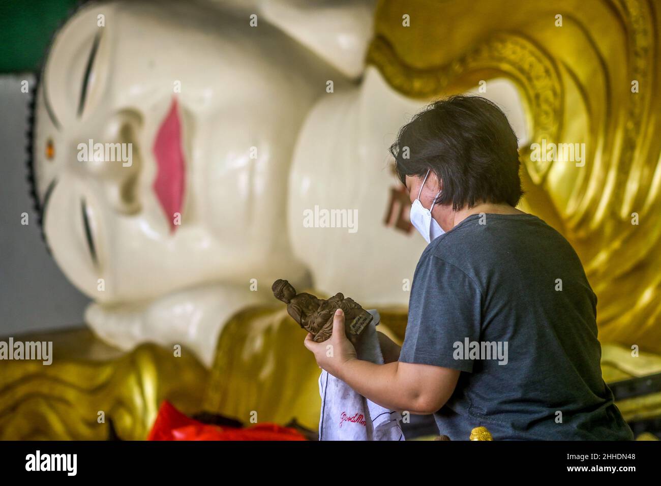 the tradition of cleaning altars and statues of gods at the Buddhist ...