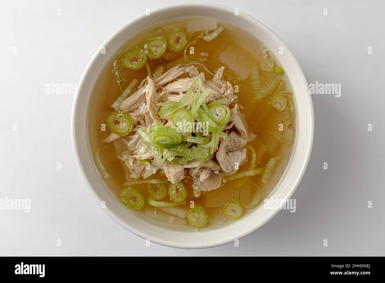 Chicken stock on a white background Stock Photo - Alamy