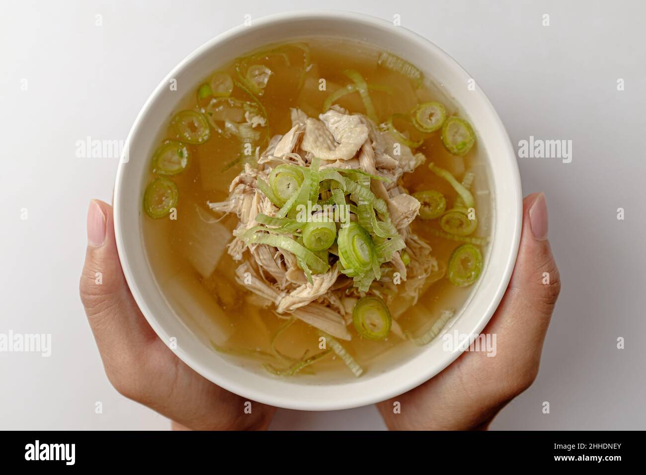 Chicken stock on a white background Stock Photo - Alamy