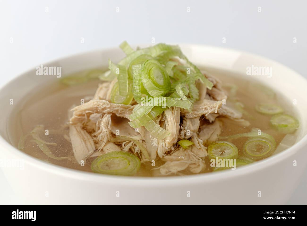 Chicken stock on a white background Stock Photo - Alamy
