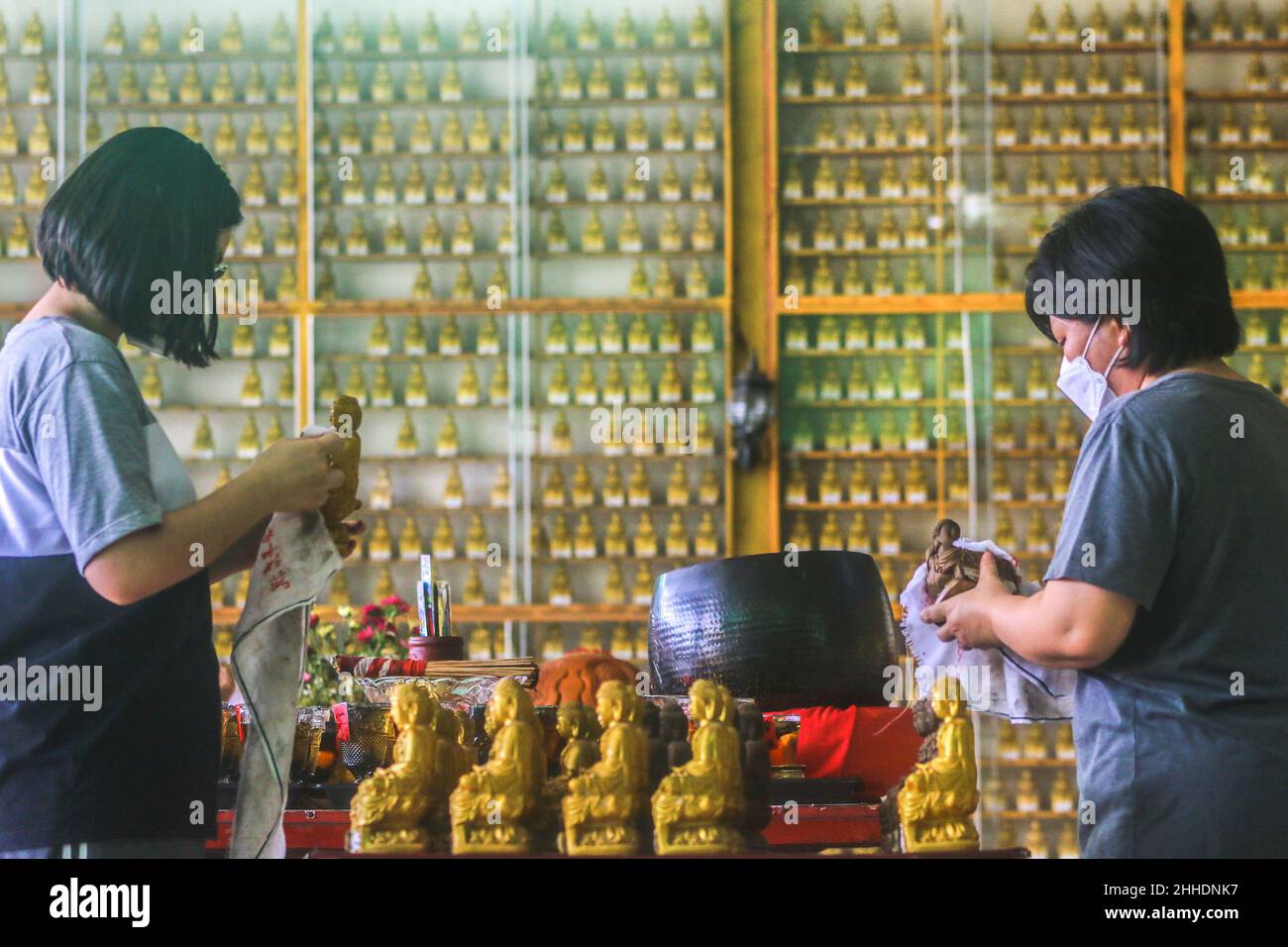 the tradition of cleaning altars and statues of gods at the Buddhist ...