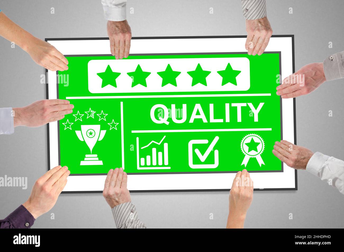 Quality concept on a whiteboard held by hands Stock Photo - Alamy