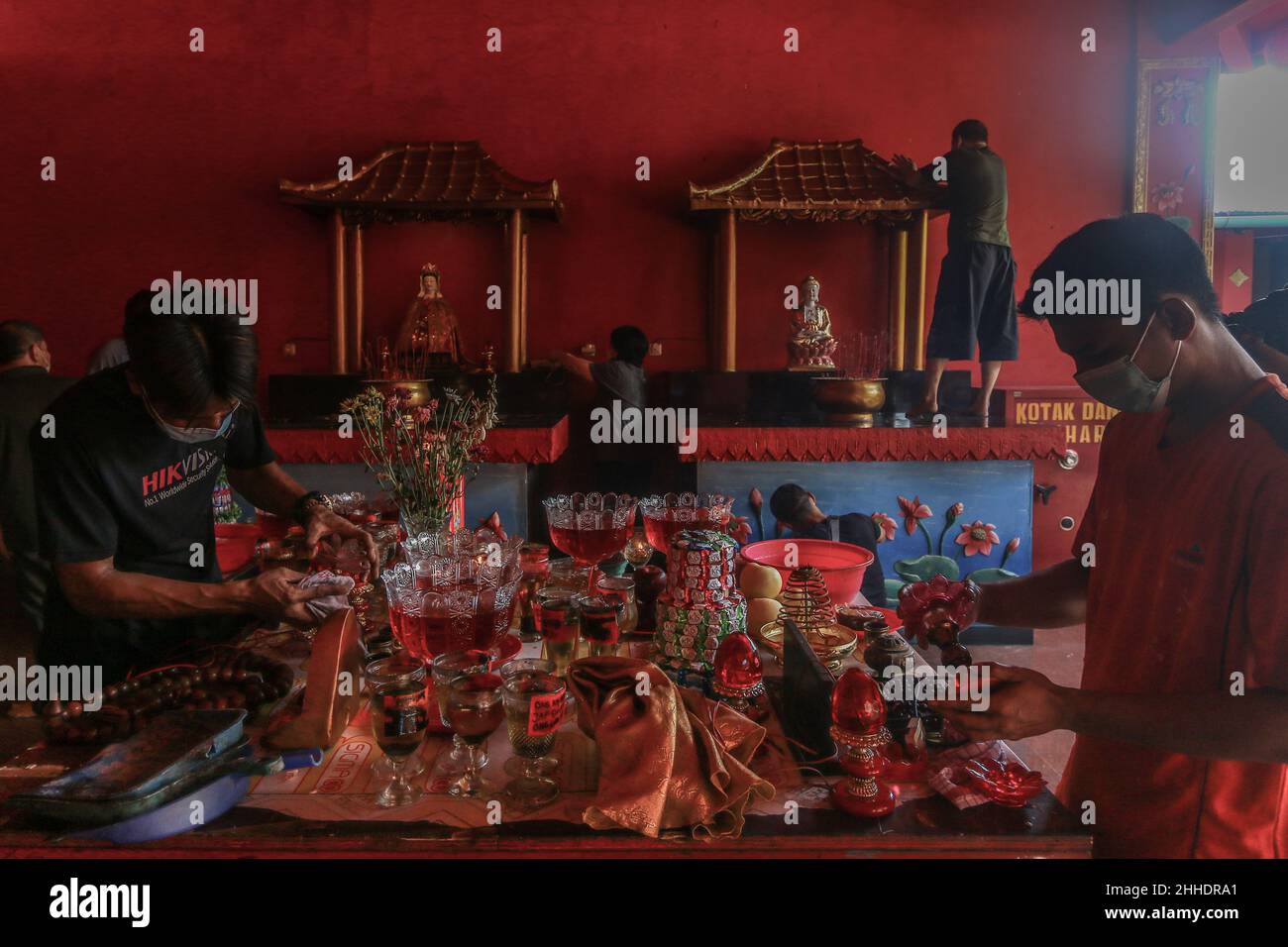 the tradition of cleaning altars and statues of gods at the Buddhist ...