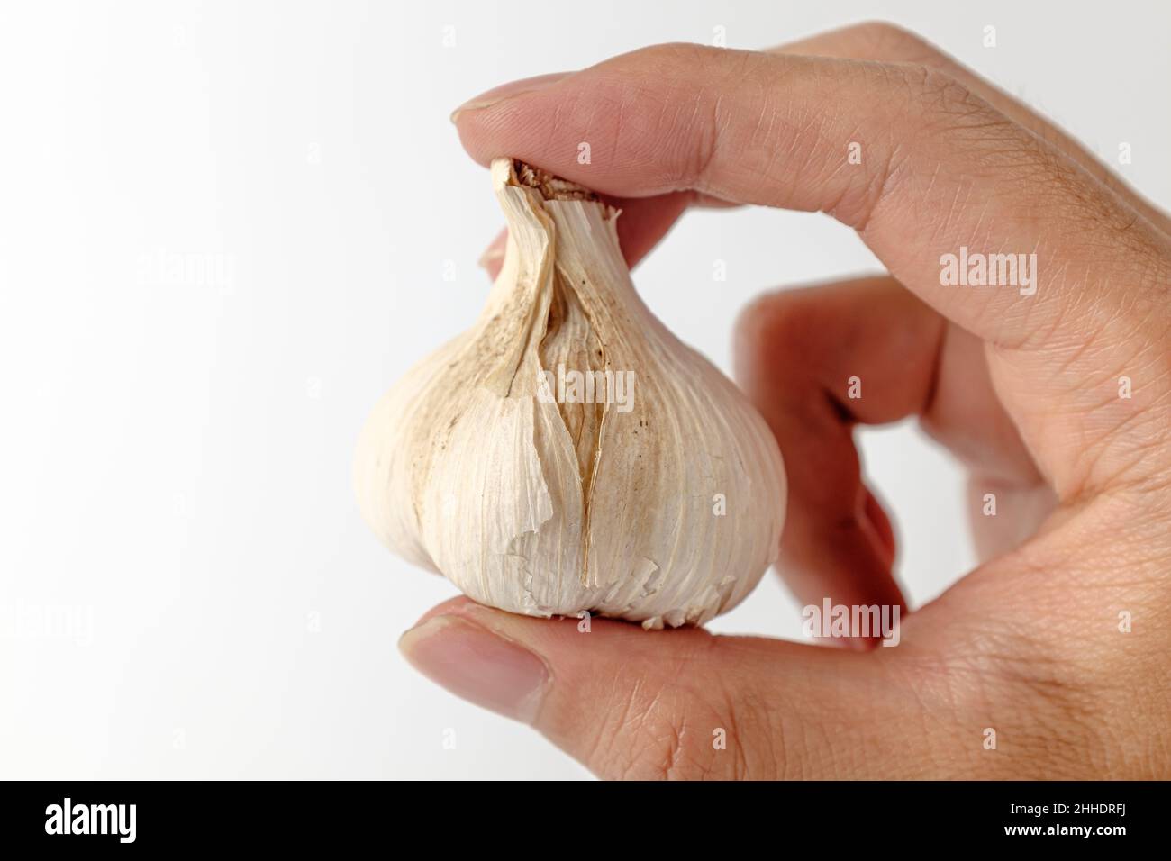 raw garlic on a white background Stock Photo - Alamy