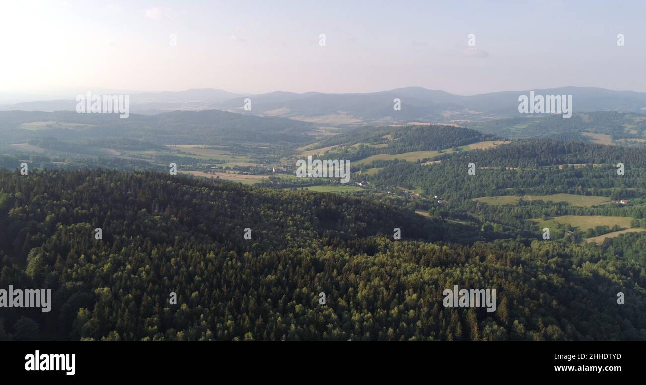Flying over mountainside pine trees hi-res stock photography and images ...