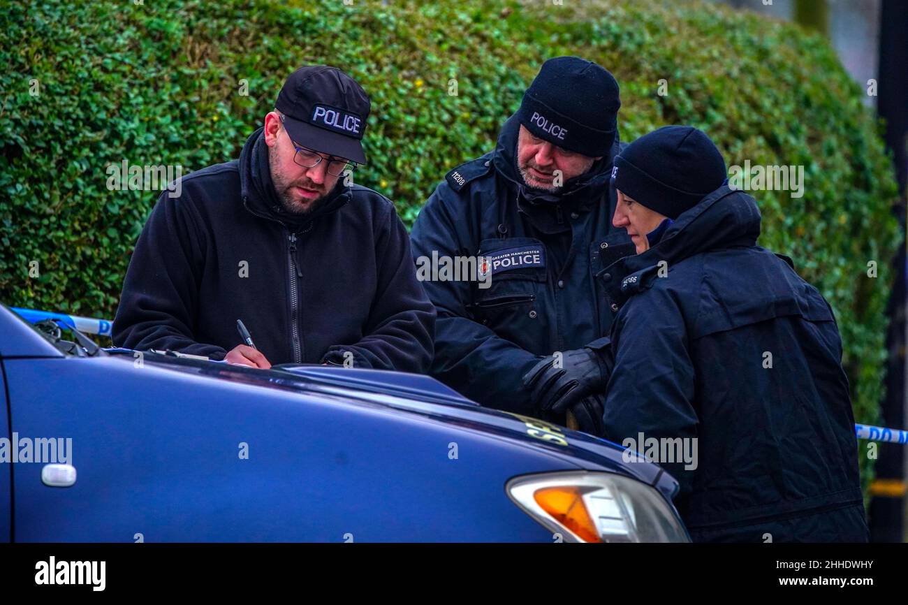 Greater Manchester Police officers searching for evidence at the scene ...