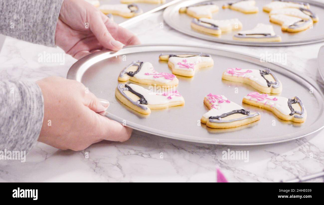 Icing figure skate shaped sugar cookies with royal icing Stock Photo ...