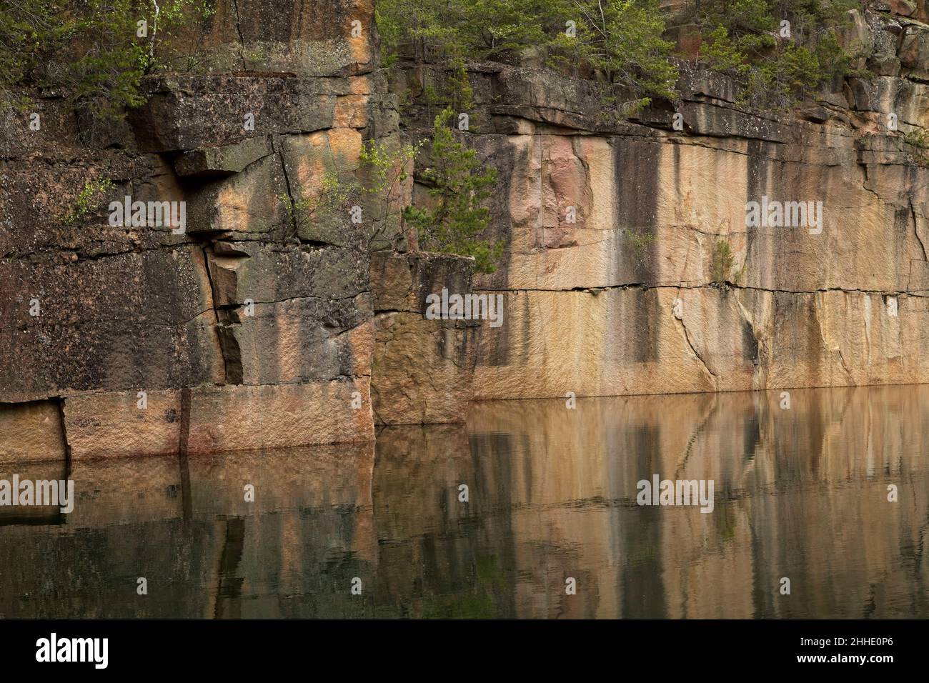A rock quarry filled with water Stock Photo - Alamy