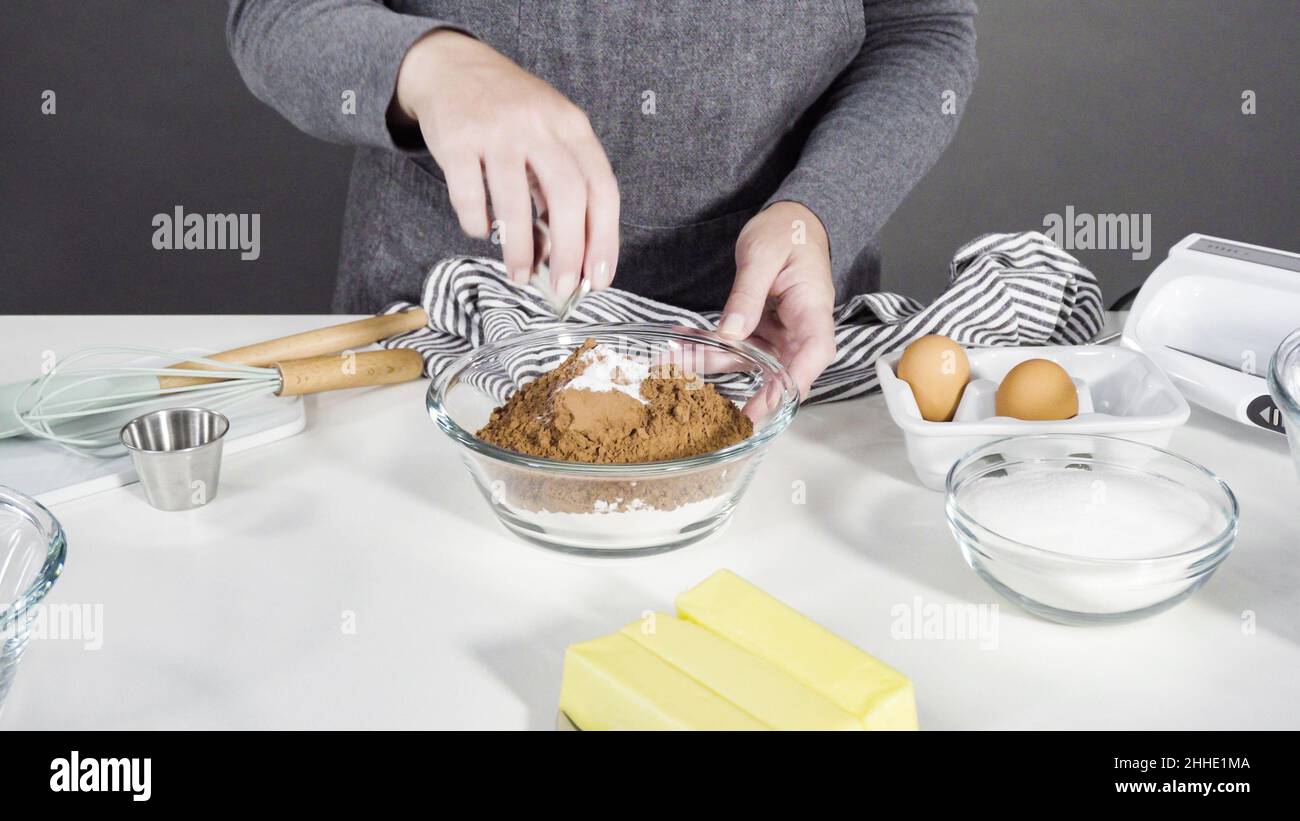 Step by step. Mixing ingredients in a glass mixing bowl to bake ...