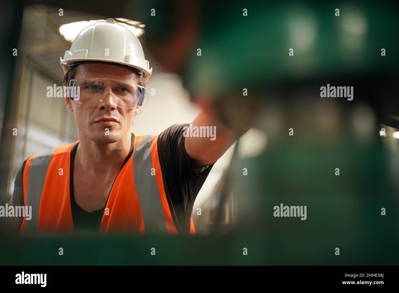 Factory Engineer Operating Hydraulic Tube machine. Men industrial ...