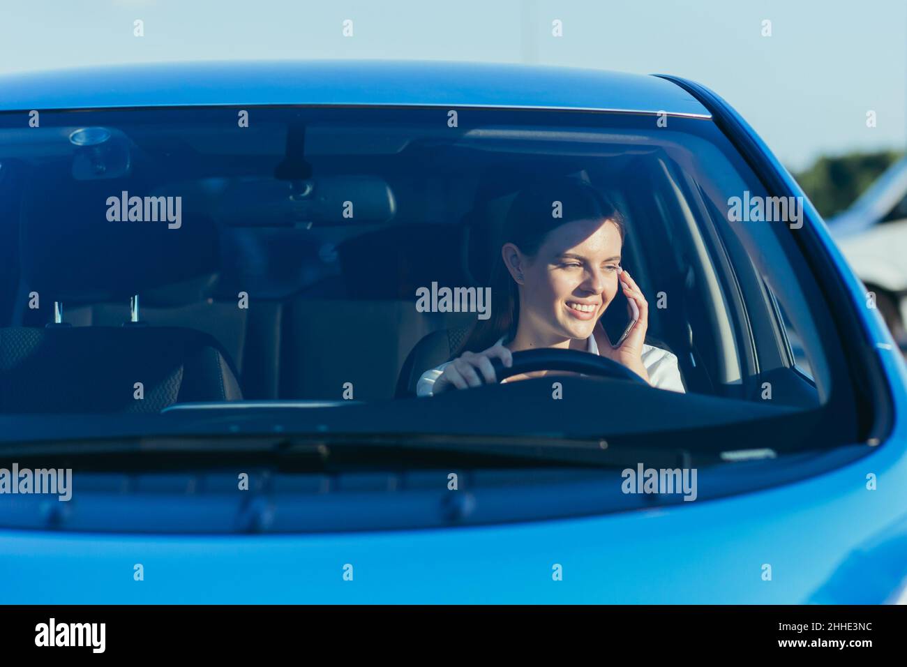 Happy woman driving from front hi-res stock photography and images - Alamy