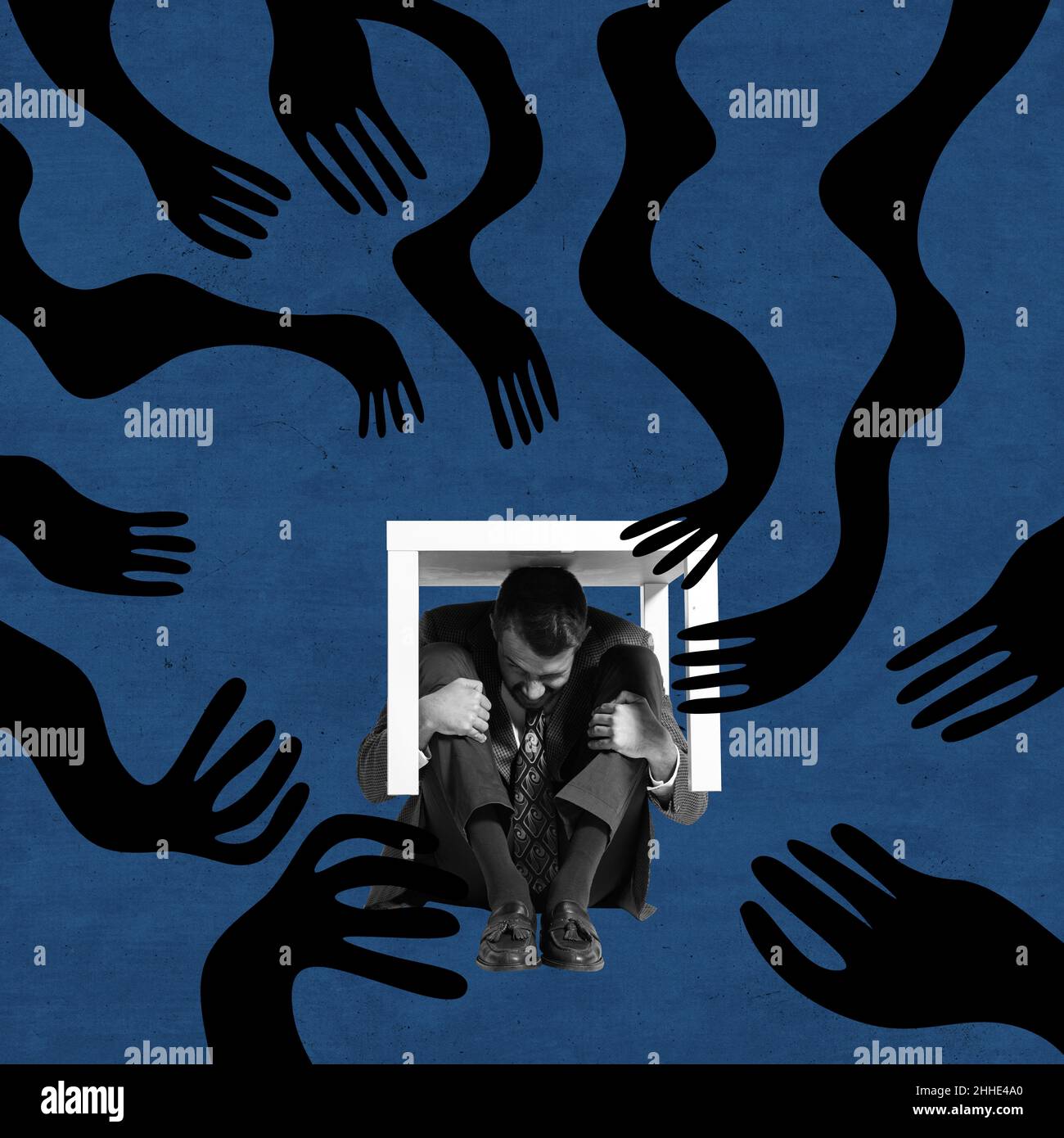 Young scared man hiding from giant drawn black creeping arms isoltaed ...