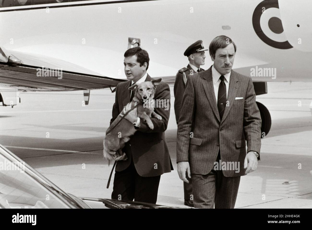 Queen's aids at Heathrow Airport August 1982 with Corgis Stock Photo ...