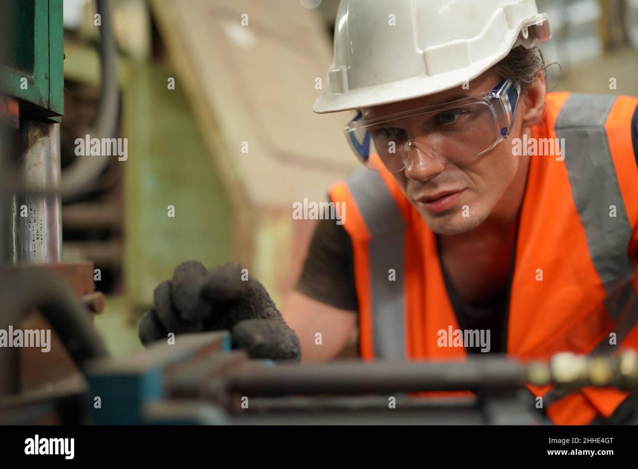Factory Engineer Operating Hydraulic Tube machine. Men industrial ...