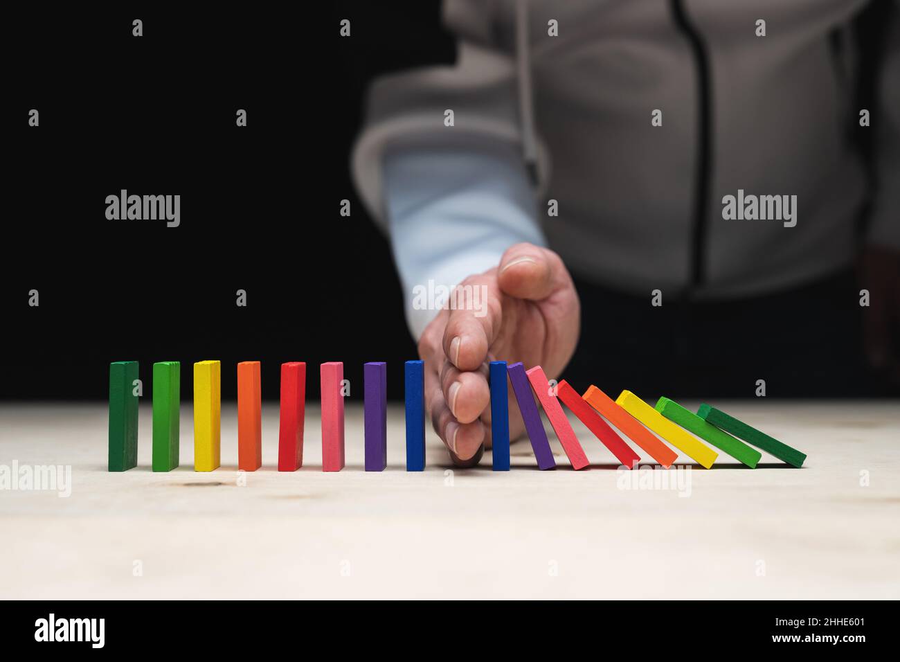 Finger pushing dominoes hi-res stock photography and images - Alamy