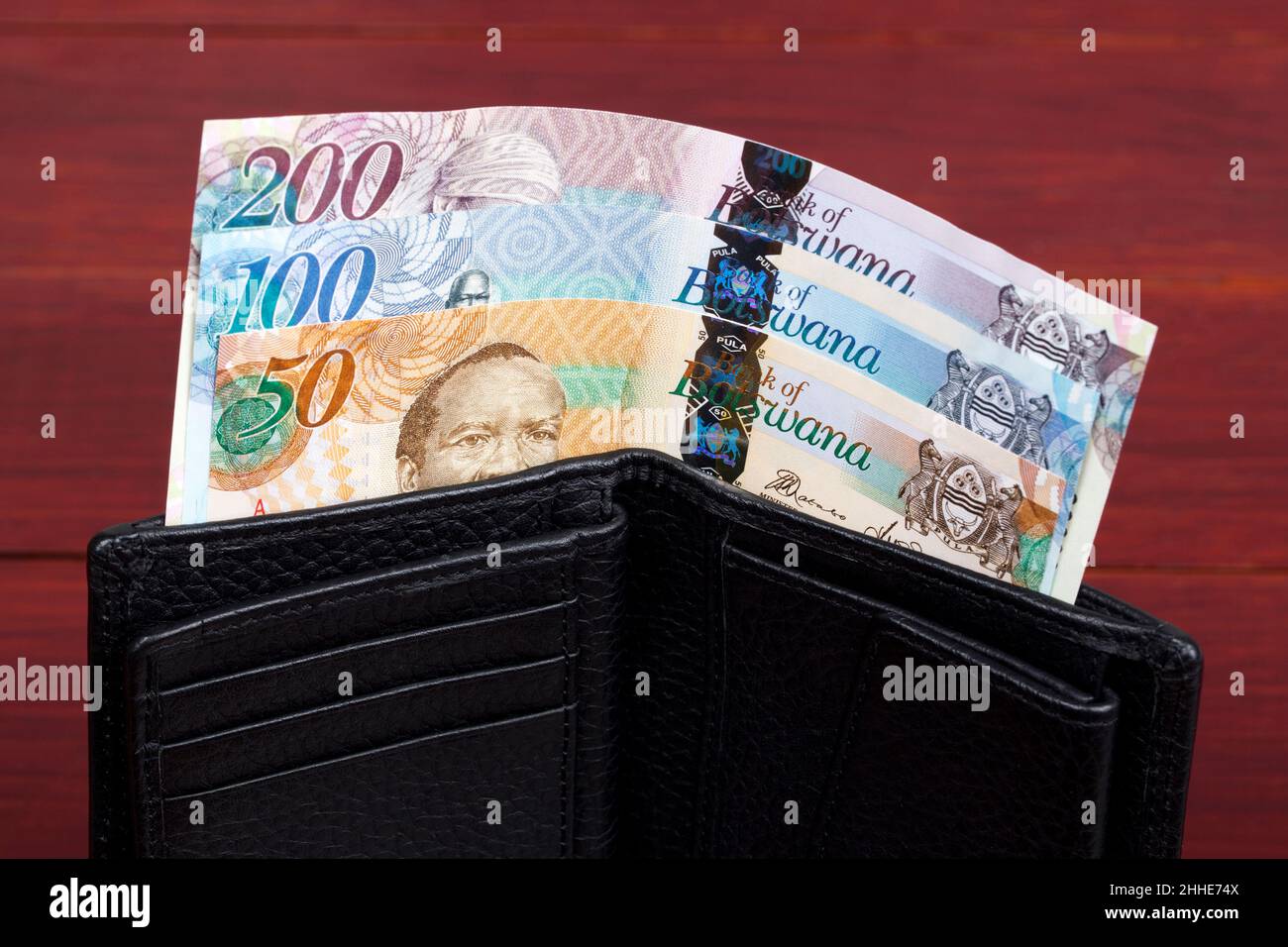 Botswana money - pula in the black wallet Stock Photo - Alamy