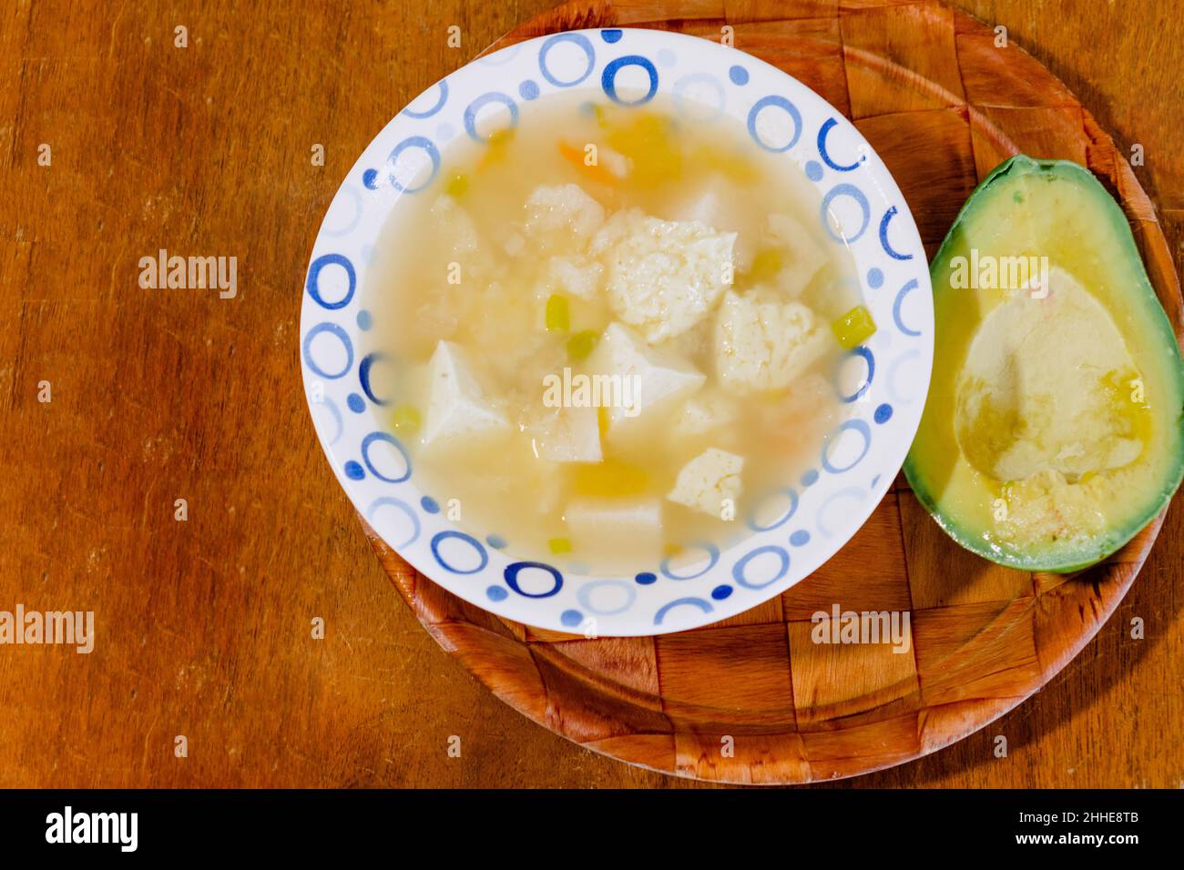A bowl of Colombian mote de queso, thick yam soup with onion, garlic ...