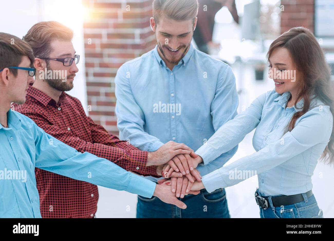 Group of people hands together partnership teamwork Stock Photo - Alamy