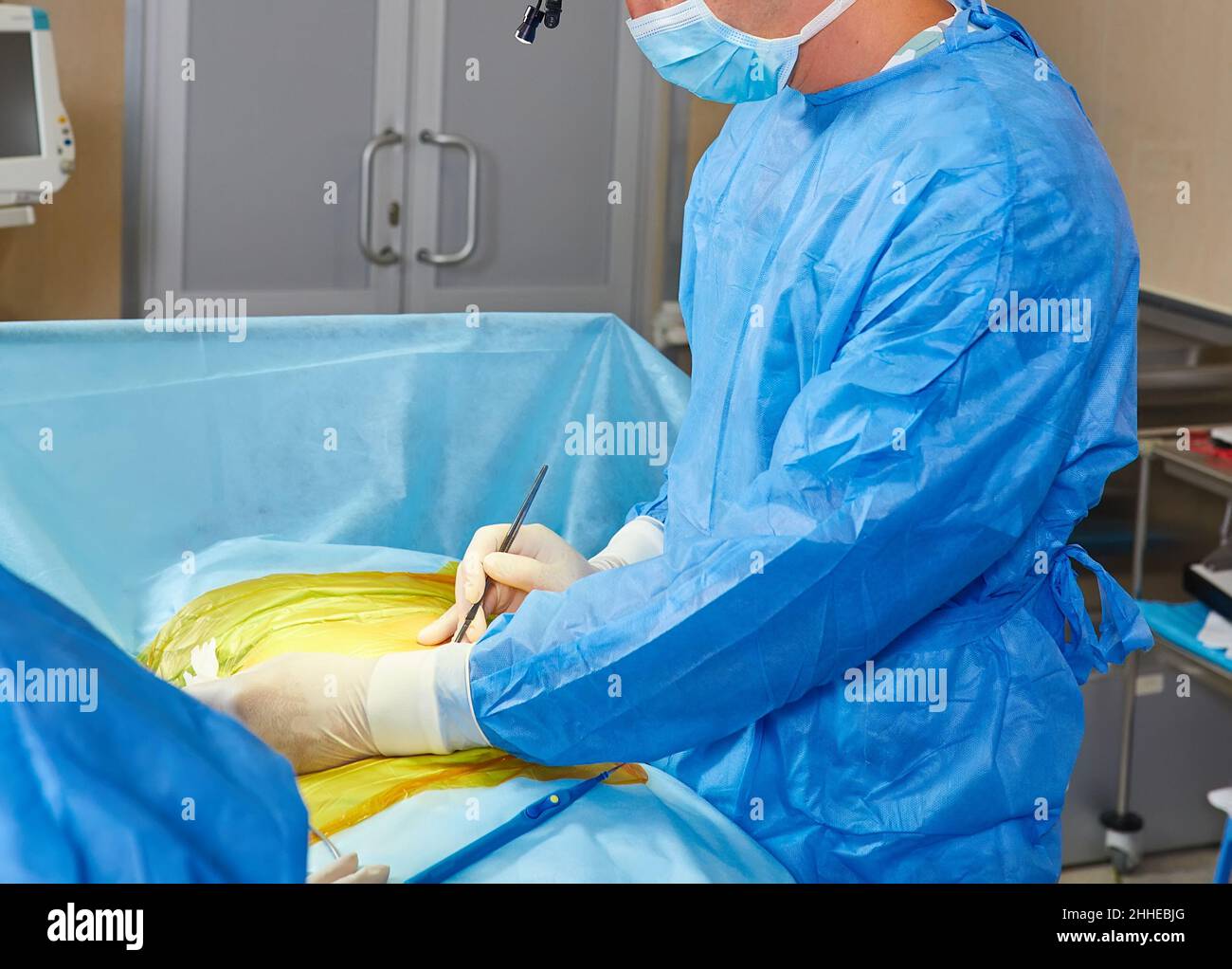 Medical team of surgeons in hospital doing minimal invasive surgical ...