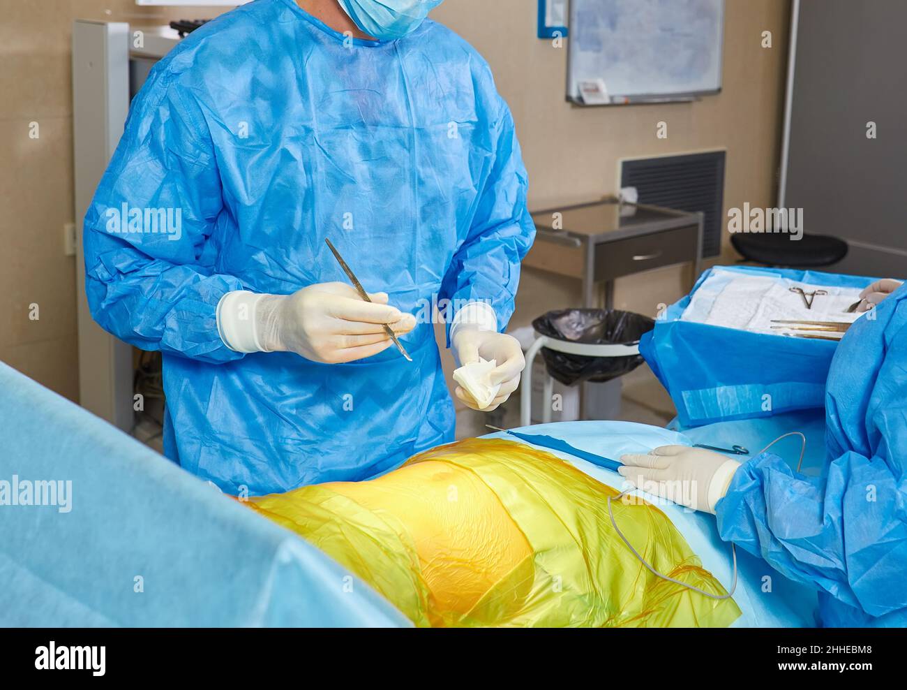 Medical team of surgeons in hospital doing minimal invasive surgical ...