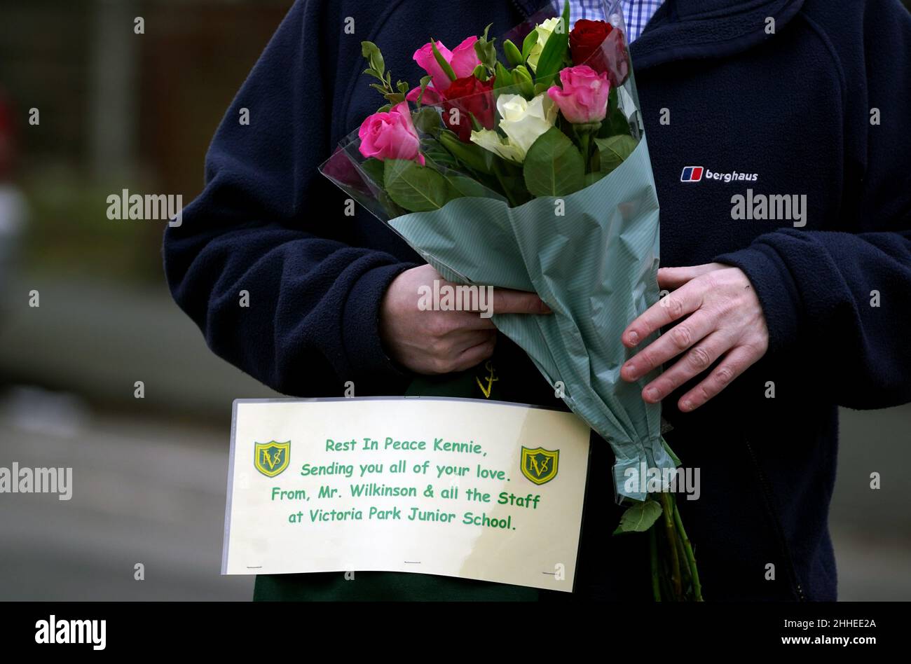 A member of public with flowers on Thirlmere Avenue in Stretford ...