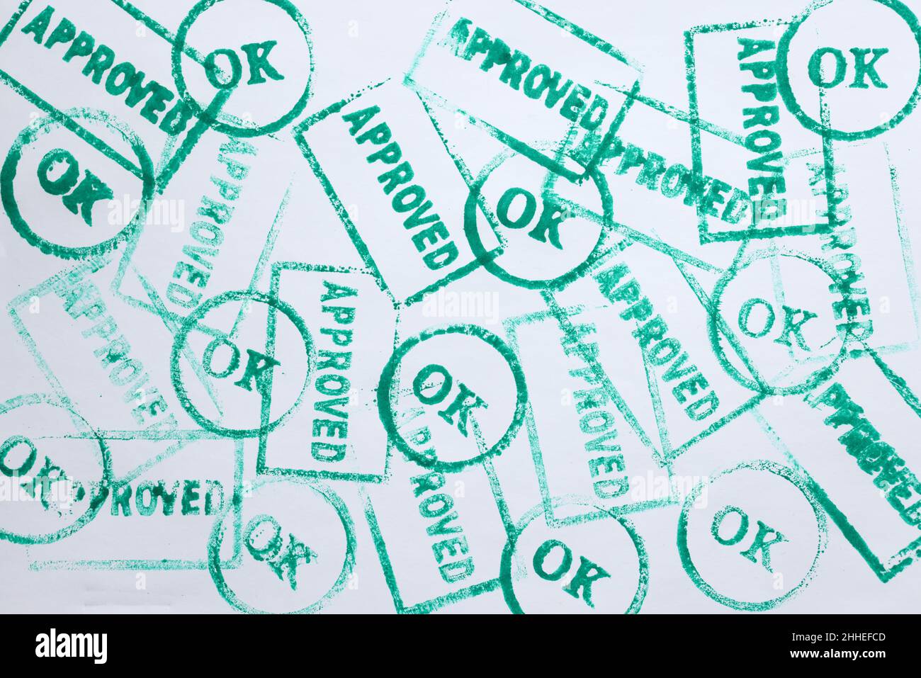 Many stamps approved and ok on paper closeup background Stock Photo - Alamy