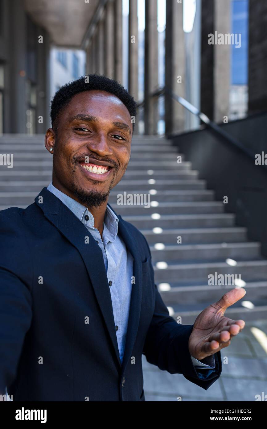 vertical view smartphone camera African American businessman speaks on ...