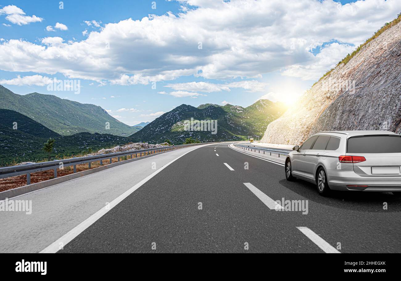 Car is driving along the road. White car on a suburban highway Stock ...