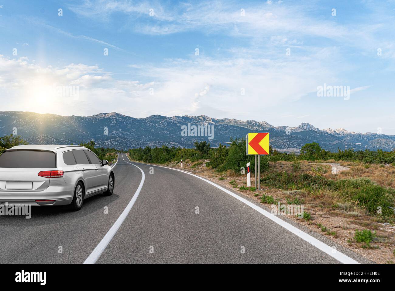 Car is driving along the road. White car on a suburban highway Stock ...