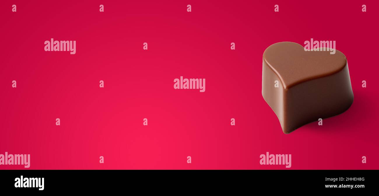 Valentines day red background of chocolate heart Stock Photo - Alamy