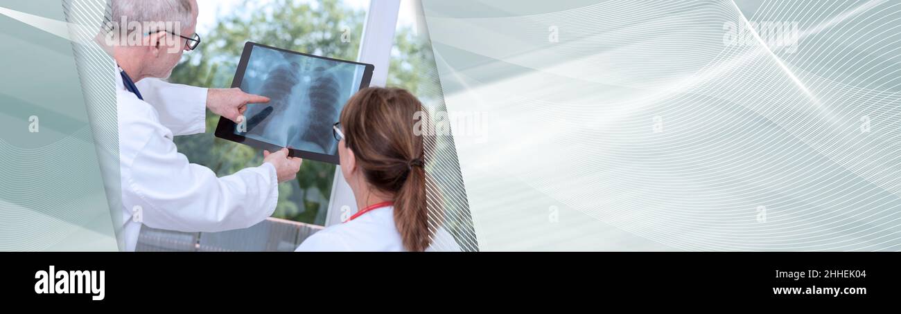 Two doctors examining x-ray report in medical office. panoramic banner ...