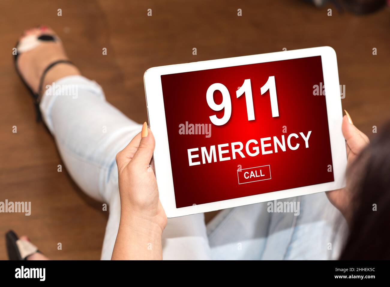 Tablet screen displaying an emergency concept Stock Photo - Alamy