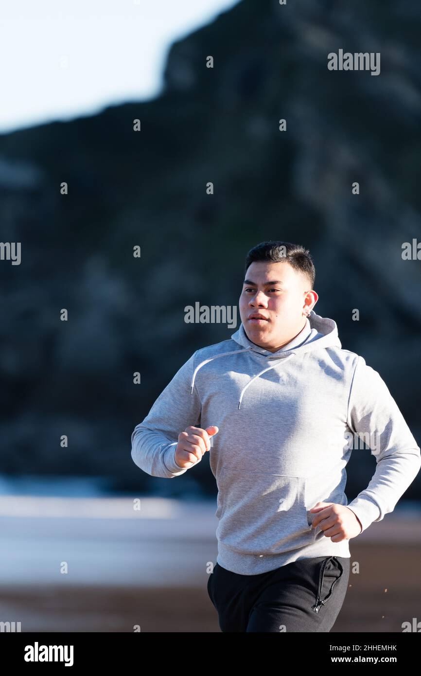 Overweight man at beach hi-res stock photography and images - Alamy