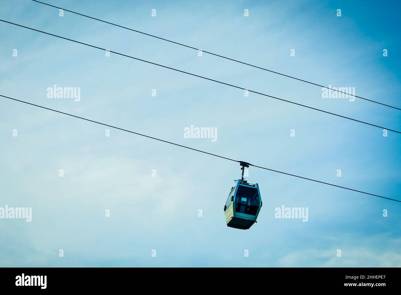 Cable car view against the sky. A ropeway with moving cabin Stock Photo ...
