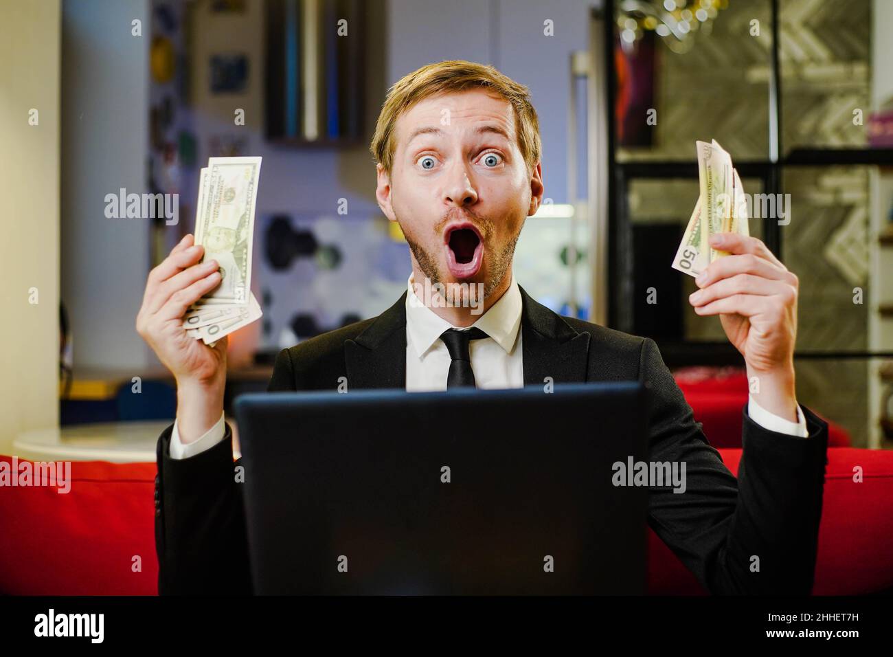 Very excited businessman trader with dollar banknotes celebrating in ...